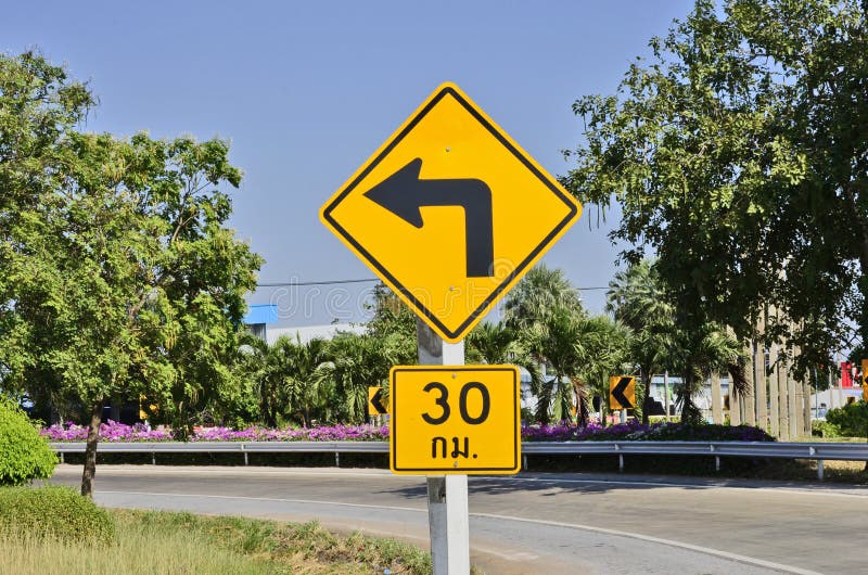 Turn Left with Limited Speed Sign Stock Photo - Image of travel, flower ...