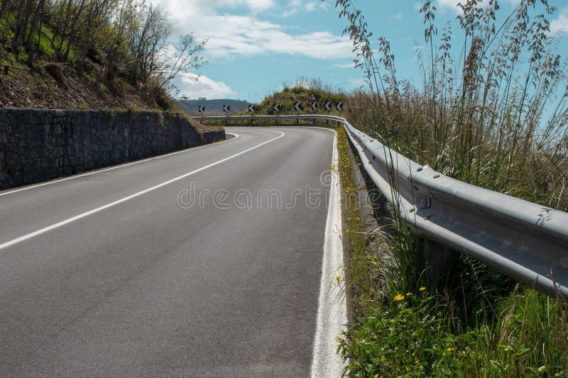 A Turn in a Mountainous Landscape. Sharp Turns, Be Careful on the Road ...