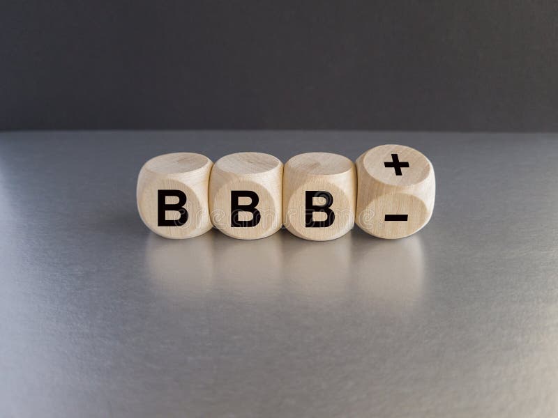 Turned a Wooden Cube and Changes the Expression BBB Minus To BBB Plus ...