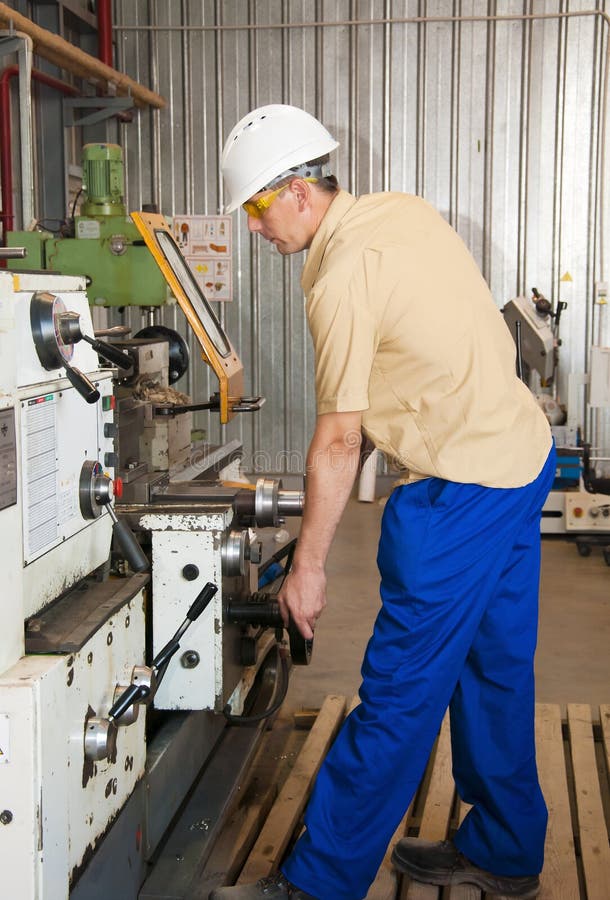The Mechanic Works at the Lathe at Factory Stock Image - Image of ...