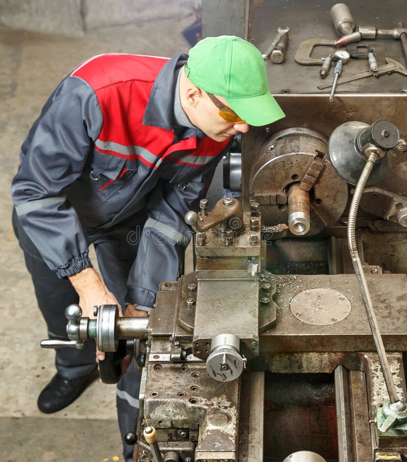 Turner works for lathe stock image. Image of factory - 51848147