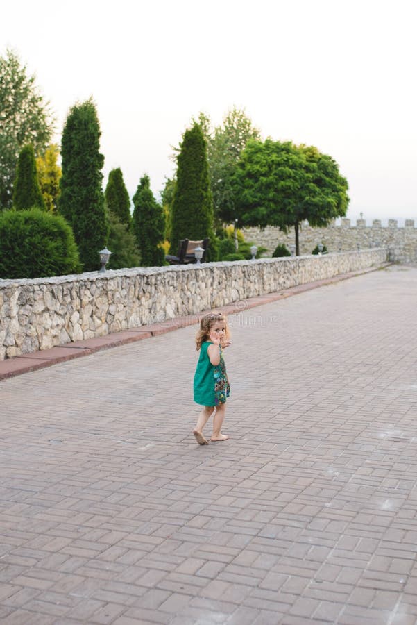 Turning Back Girl stock photo. Image of cheerful, grass - 84835770