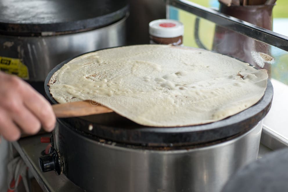 Turning a Crepe with a Wooden Scraper Stock Image - Image of flapcake ...