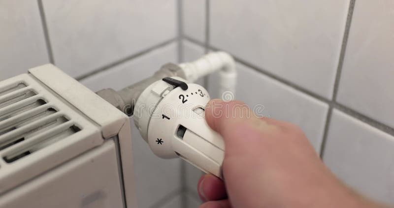 Turning Down the Heating Radiator Temperature Regulator Stock Video ...