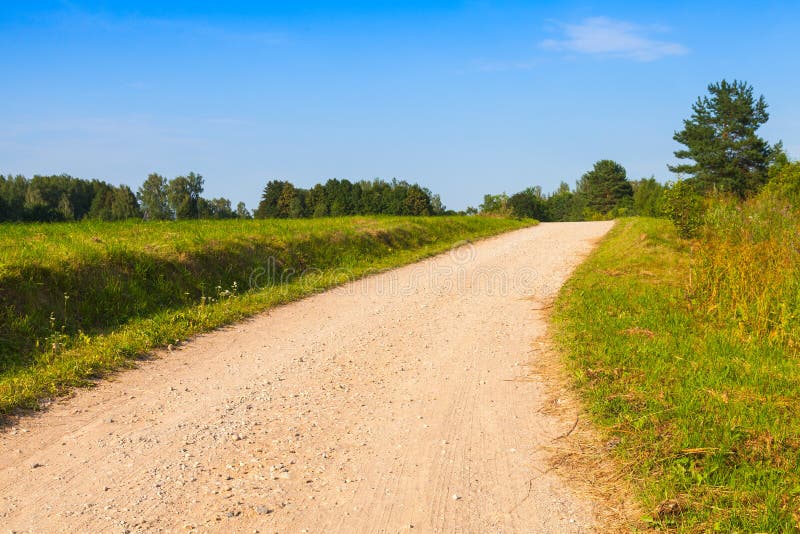 Empty Rural Road Going through Prairie Under Cloudy Sky Stock Photo ...