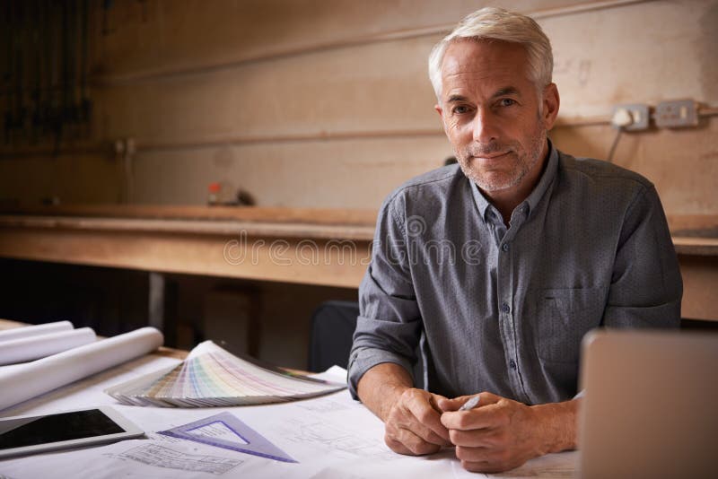 Turning His Vision into Reality. an Architect Drawing Up Plans. Stock ...