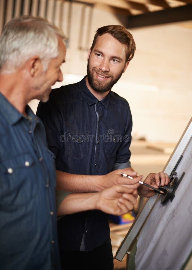 Turning His Vision into Reality. an Architect Drawing Up Plans. Stock ...