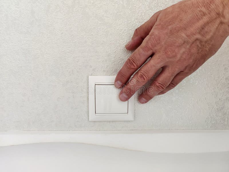 Turning Light on - Off. Man Pressing Light Switch on White Wall, Close ...