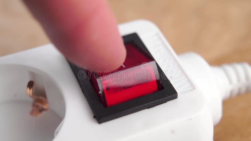 Turning on the Red Switch of the Electrical Splitter in Wall Outlet ...