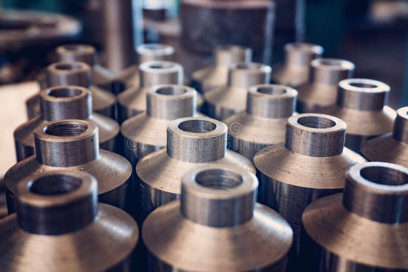 Round Parts with Drawings after Turning are on a Wooden Rack in the ...