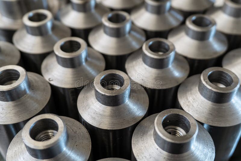 Round Parts with Drawings after Turning are on a Wooden Rack in the ...