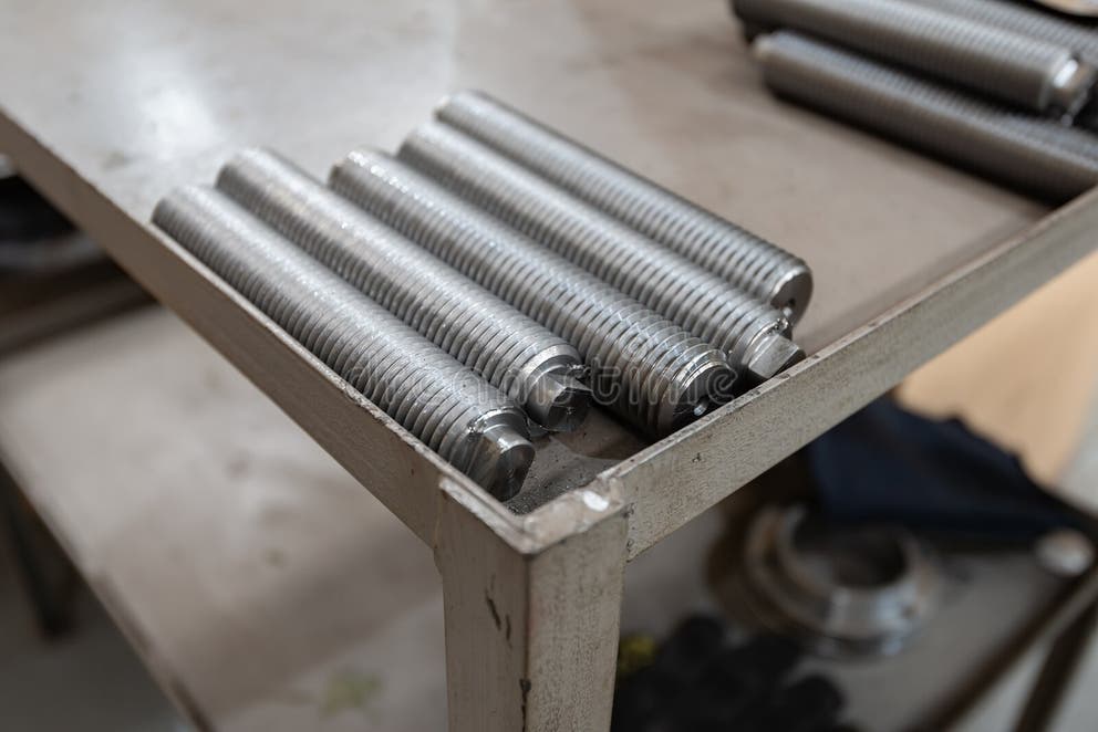 After Turning, the Threaded Rods are on the Rack Stock Image - Image of ...