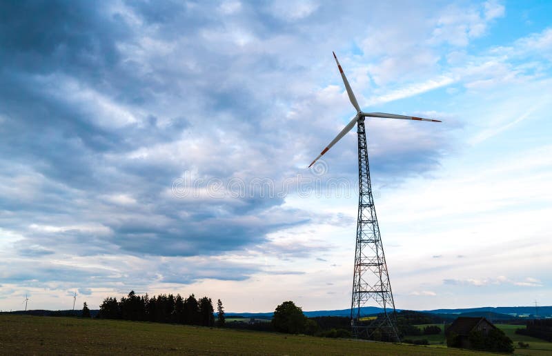 Turning Wind Engines in Front of a Dramatic Sky Stock Image - Image of ...