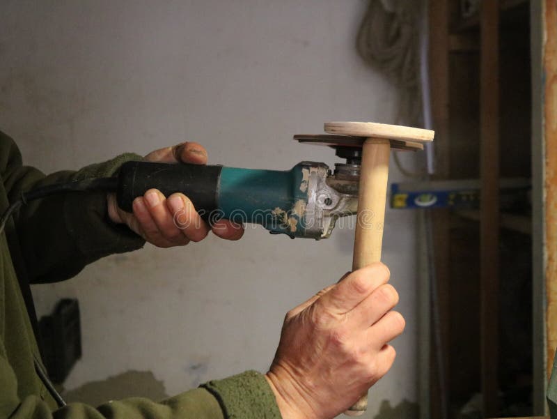 Grinding Wooden Tools with a Hand Grinder Stock Photo - Image of ...