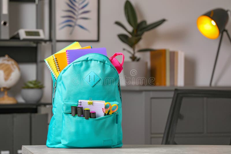 Turquoise Backpack with Different School Stationery on Table Indoors ...
