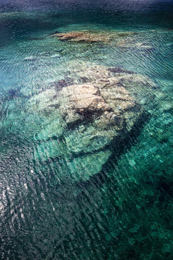 Turquoise Colored Water with Rock Stock Photo - Image of rock, maritime ...