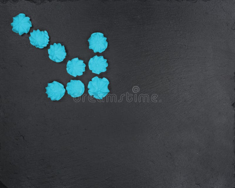 Turquoise Cookies in a Diagonal Shape of an Arrow on Dark Slate Stock ...