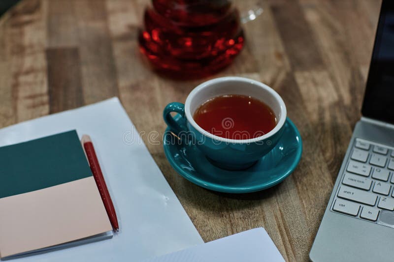 Turquoise Cup of Tea on Wooden Table Stock Photo - Image of device ...
