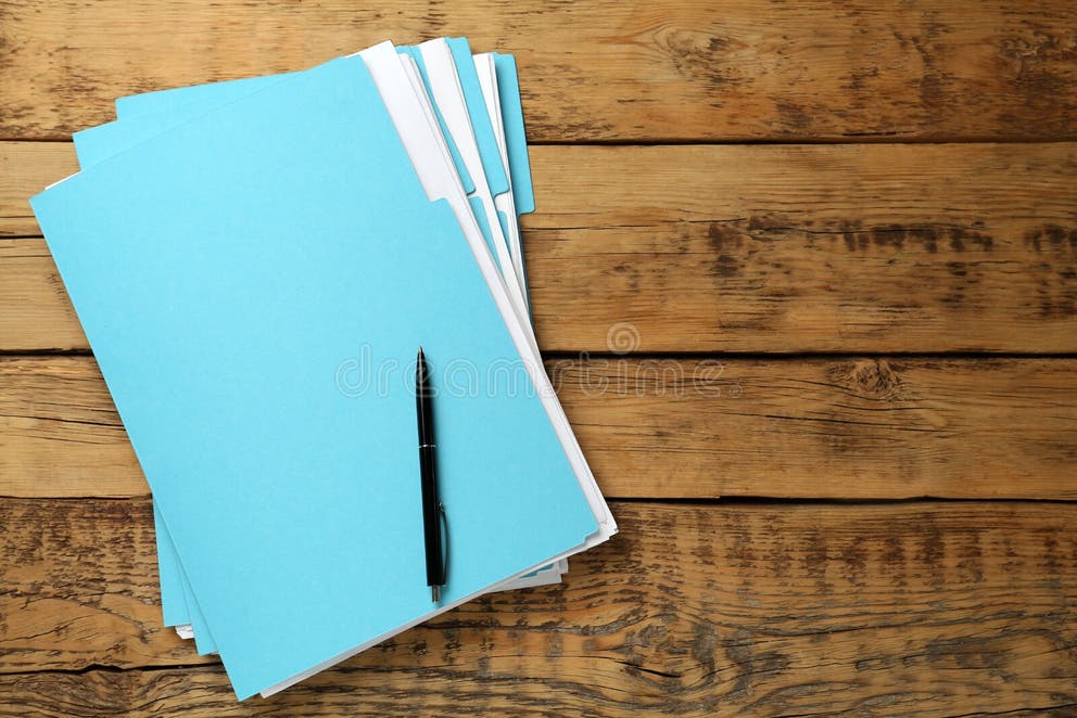 Turquoise Files with Documents and Pen on Wooden Table, Top View. Space ...