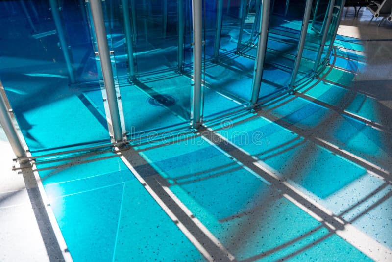 Turquoise Glass Panes Reflecting Onto a White Marble Floor Stock Image ...