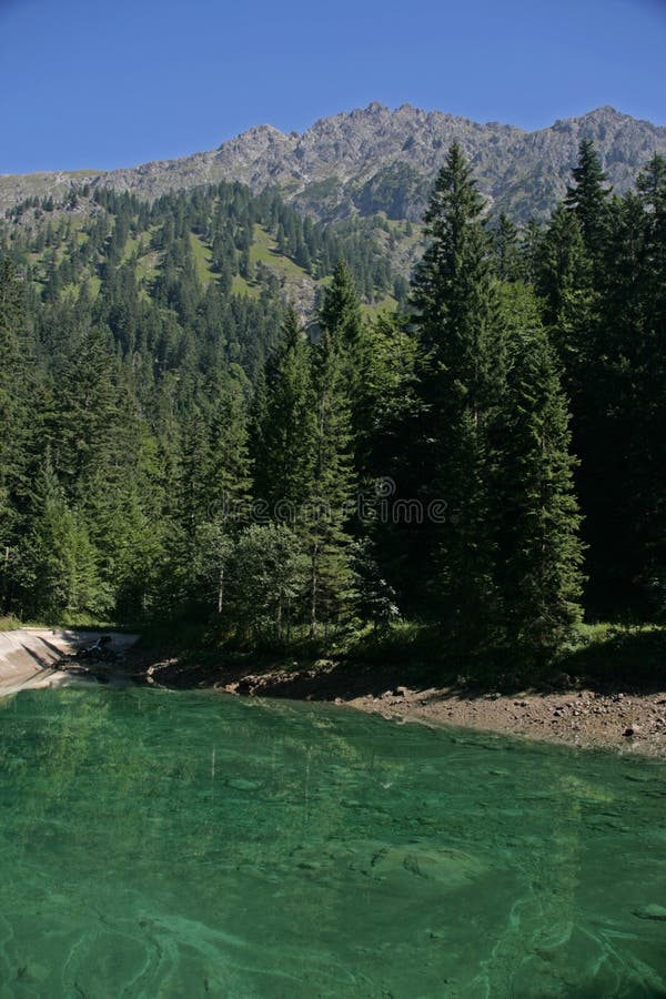 Turquoise lake stock image. Image of spring, green, meadow - 60326721