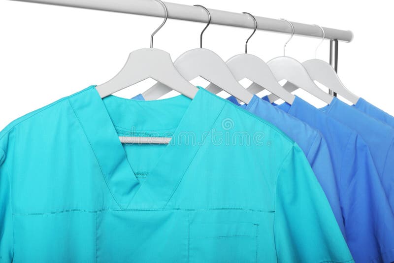 Turquoise and Light Blue Medical Uniforms on Rack Against White ...