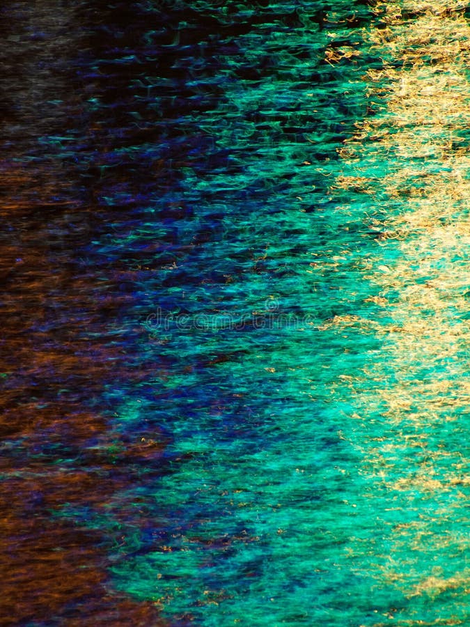 Turquoise and Orange Light Glow Causing Water Glass Reflections Stock ...