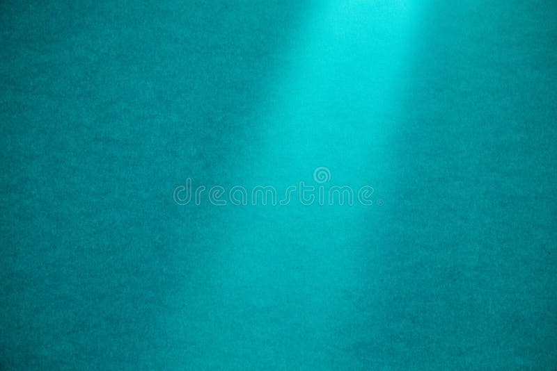 A Turquoise Ray of Light Crosses a Dark Turquoise Small-textured ...