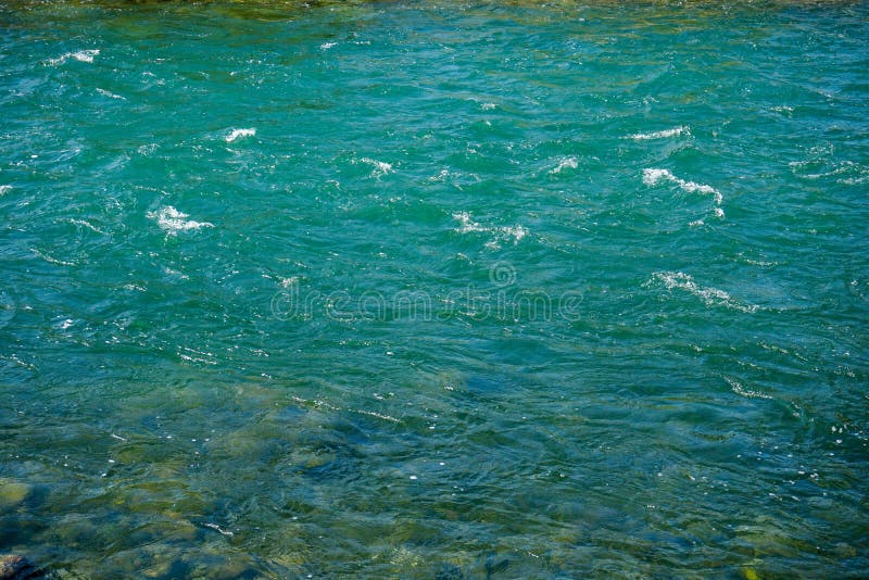 Turquoise River Water with Small Waves and Stones Stock Image - Image ...