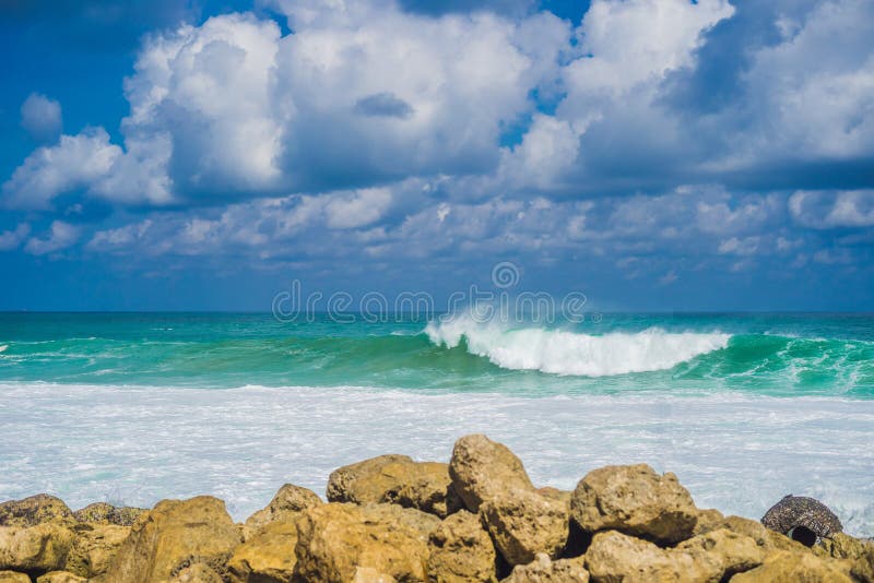 Turquoise Rolling Wave Slaming on the Rocks Stock Photo - Image of ...