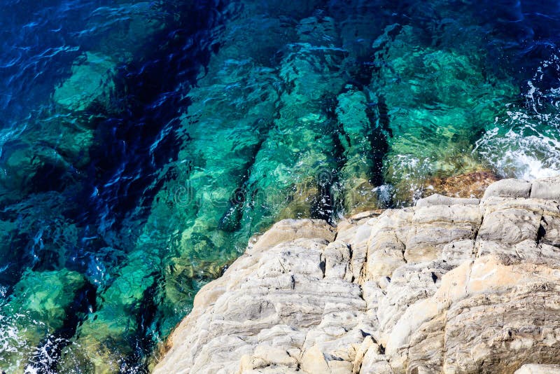 Turquoise Sea Surface and Rocks near Manarola - Stock Image - Everypixel