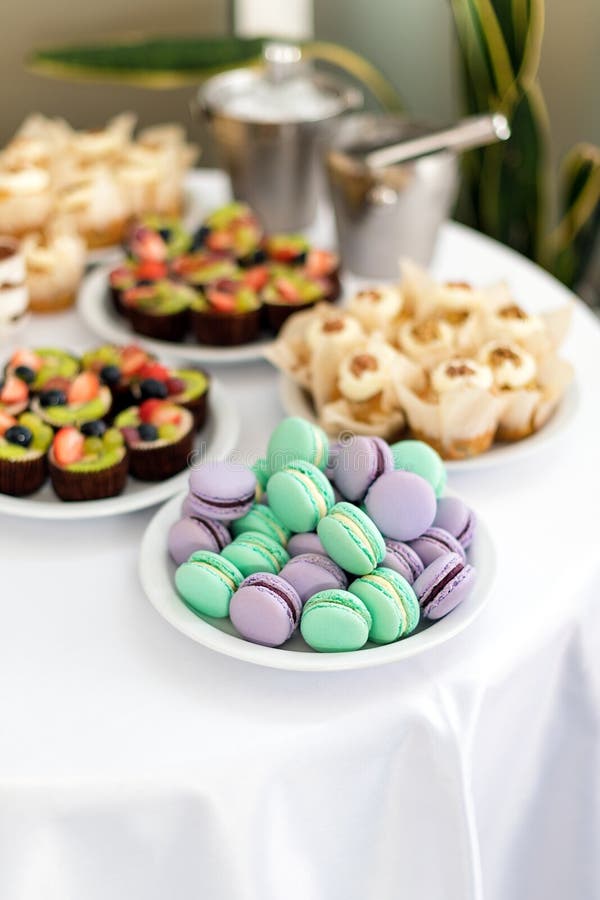 Turquoise and Violet Macarons. Wedding Cakes on the Table. Sweet ...
