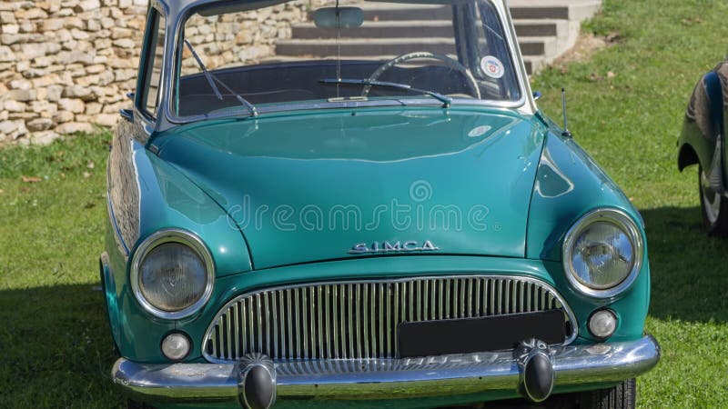 Turquoise and White Vintage Simca Aronde Car Parked on Grass in Front ...