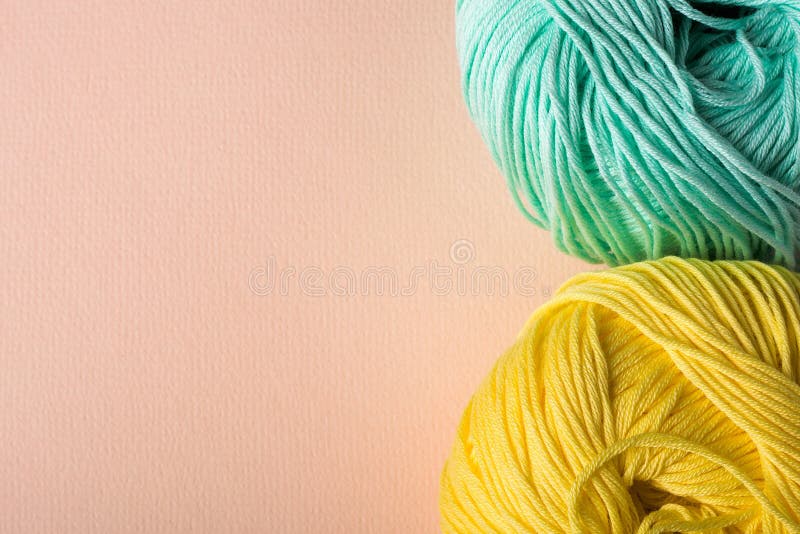 Turquoise and Yellow Tangle of Thread on a Pink Background Stock Photo ...