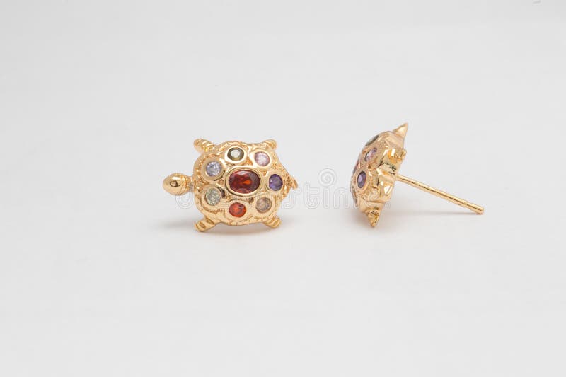 Turtle Shape Gold Earrings with Diamonds on the White Background Stock ...