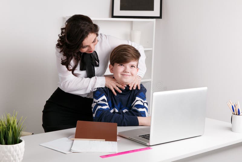 Tutor and the Boy Having Fun between Doing Homework. Stock Photo ...