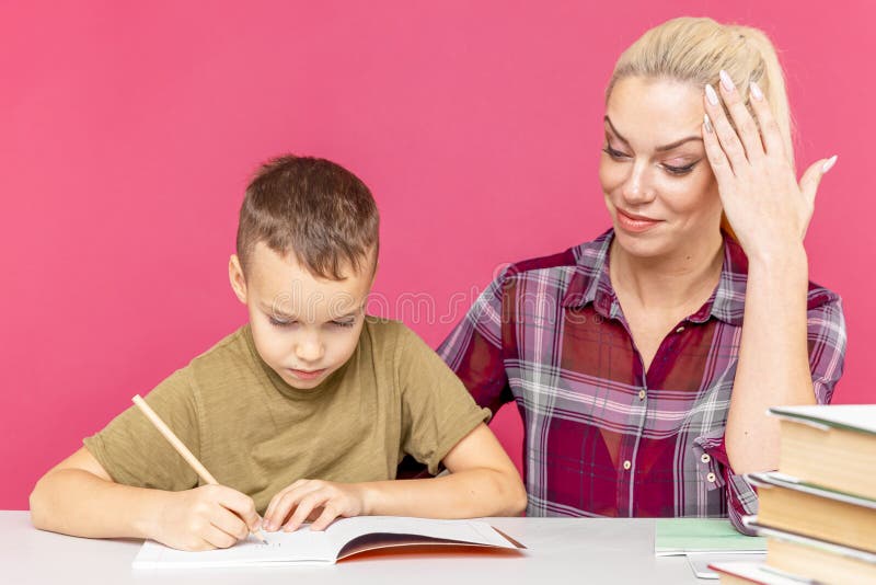Tutor with Child Doing Homework Together in the Pink Room. Stock Photo ...
