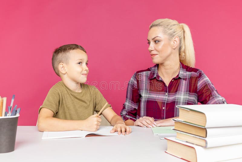 Tutor with Child Doing Homework Together in the Pink Room. Stock Photo ...