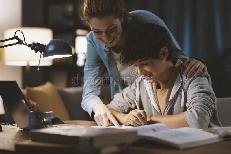 Tutor Helping a Student with His Homework Stock Photo - Image of ...