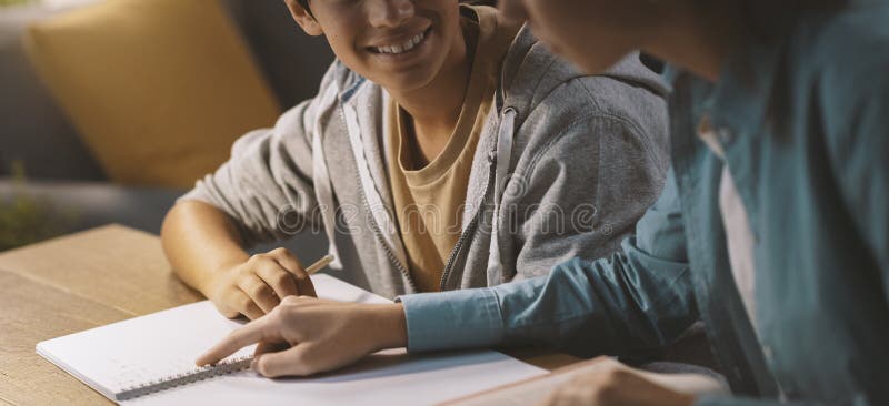 Tutor Helping a Student with His Homework Stock Image - Image of school ...