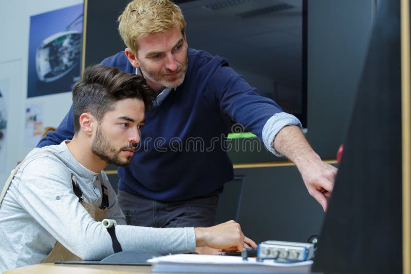 Tutor Helping Student Technician Using Computer Stock Image - Image of ...