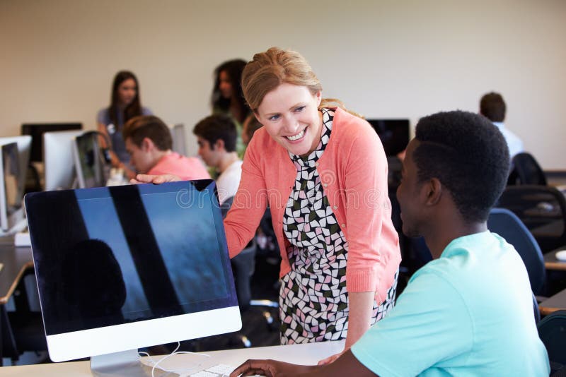 Tutor with Male College Student in Computer Class Stock Photo - Image ...
