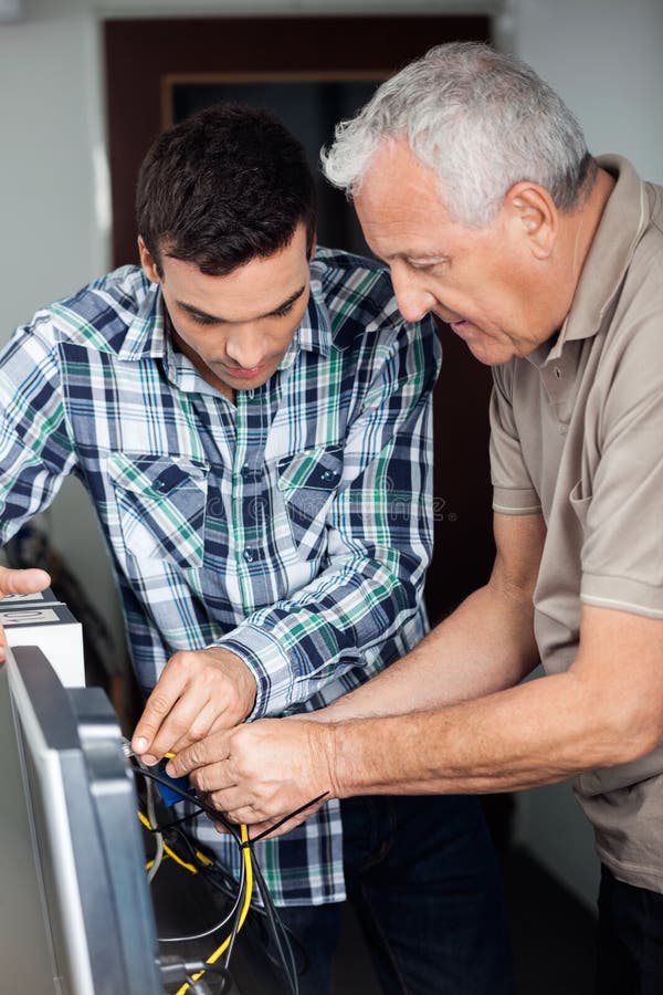 Tutor and Senior Man Fixing Computer in Class Stock Image - Image of ...