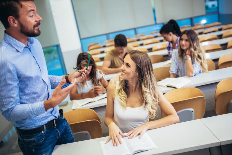 Tutor Teaching University Students in Classroom Stock Image - Image of ...