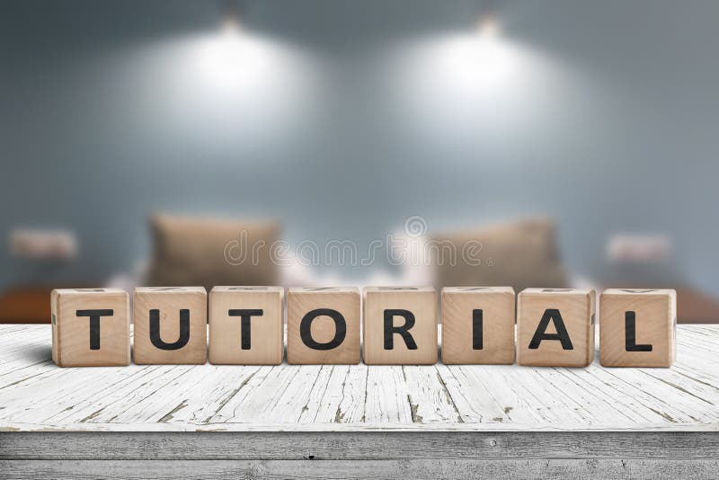 Tutorial Sign on a Wooden Table in a Room with Lights Stock Image ...