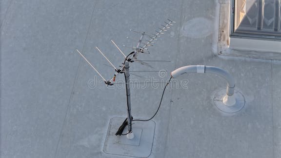 TV Antenna Rooftop Install with Cable Going into PVC Pipe Stock Photo ...