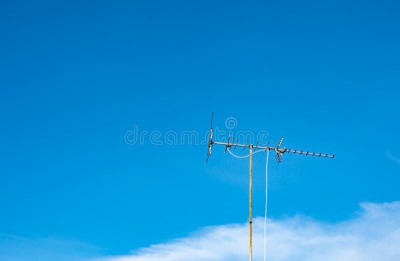 Tv antenna and the sky. stock photo. Image of blue, outdoor - 129797992