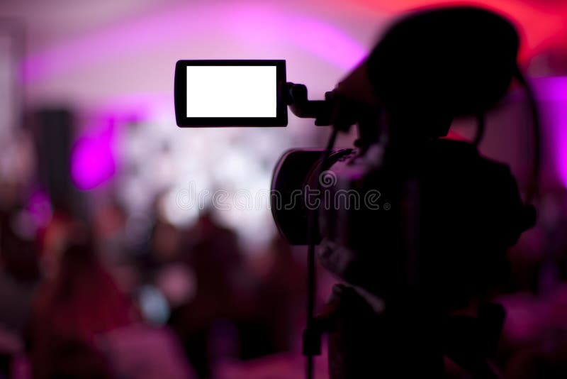 Professional Video Camera Stands on a Tripod, the Process of Filming a ...