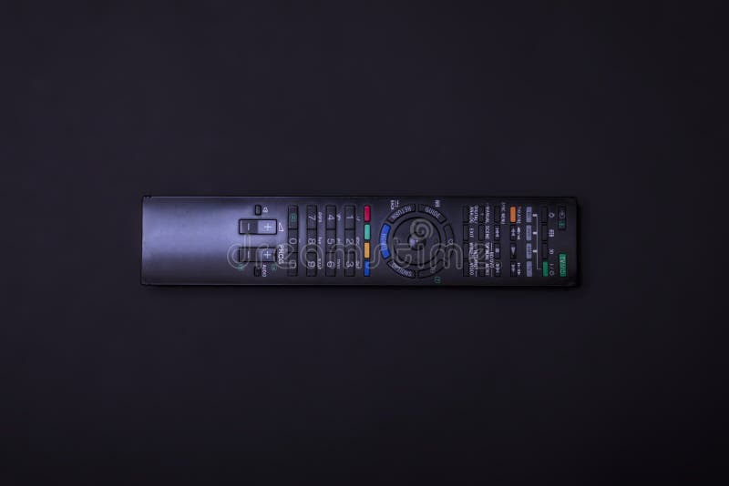 TV Control on a Black Background. Multi Control Concept. Remote Control ...