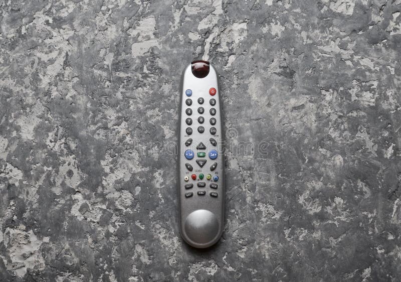 The TV Controls on a Gray Concrete Table. Top View. Remote Control of ...